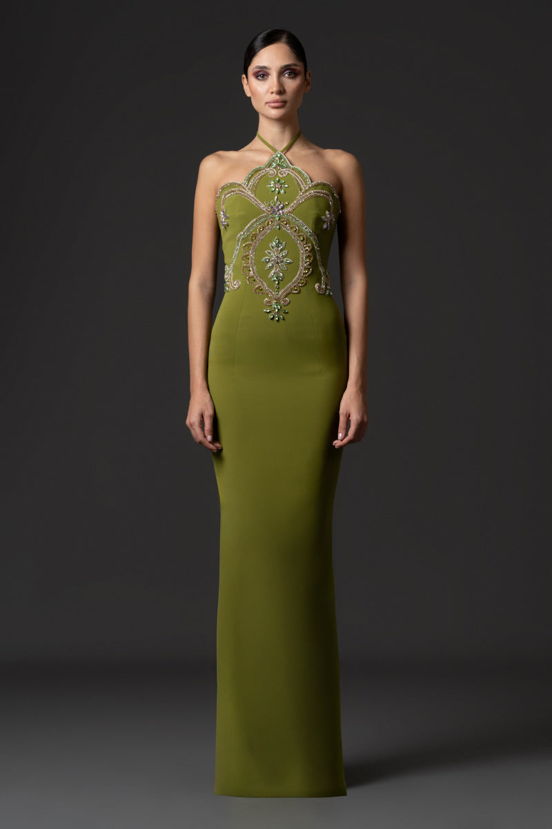 Fitted gown featuring a pointed neckline and matching sleeves