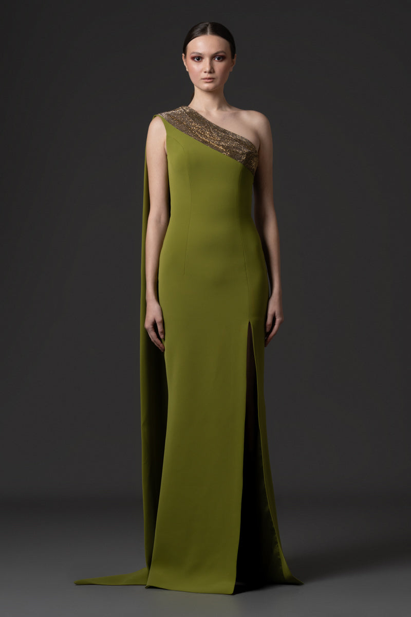Asymmetrical dress featuring a crystal embellished bust and a cascadin