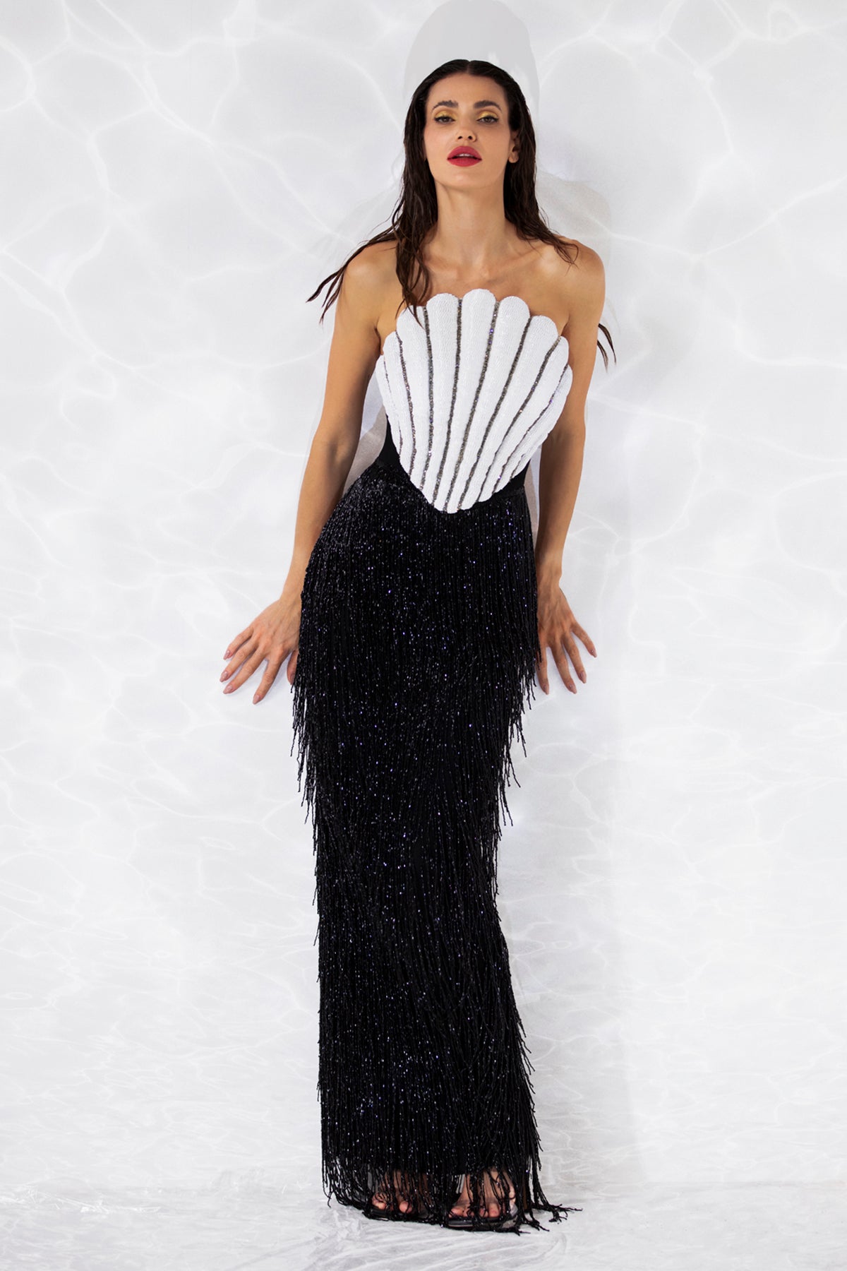 Scallop shell inspired dress consisting of a bustier embroidered with